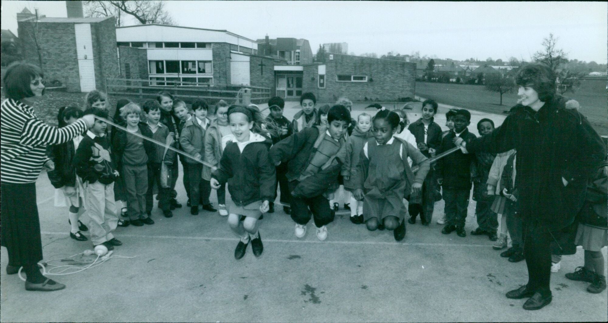 Students from St. Christopher School skip together outside their schoo