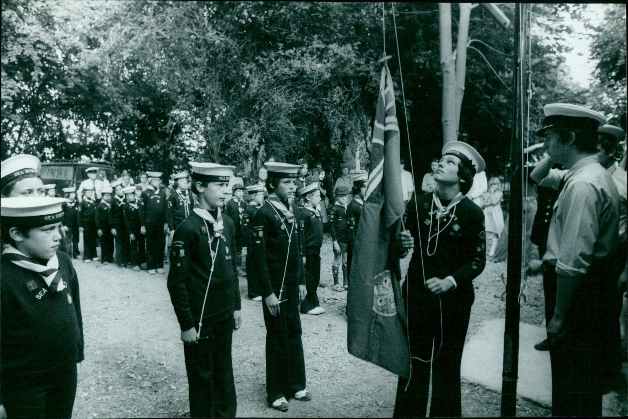 Scouts of the 42nd Oxford Sea Scouts perform a flag ceremony at the op