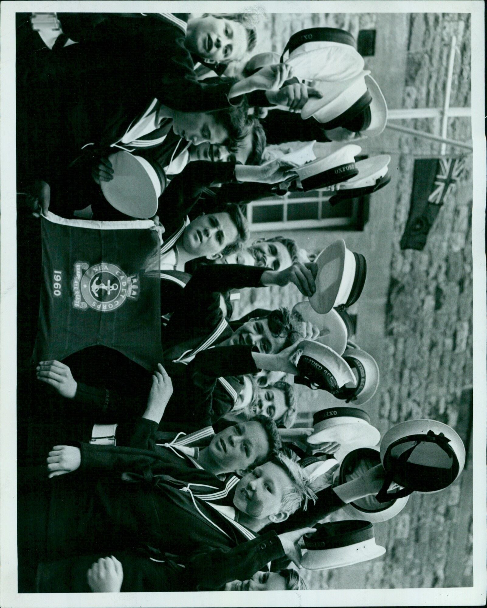The Oxford Sea Cadets proudly display their burgee for 1960, presented