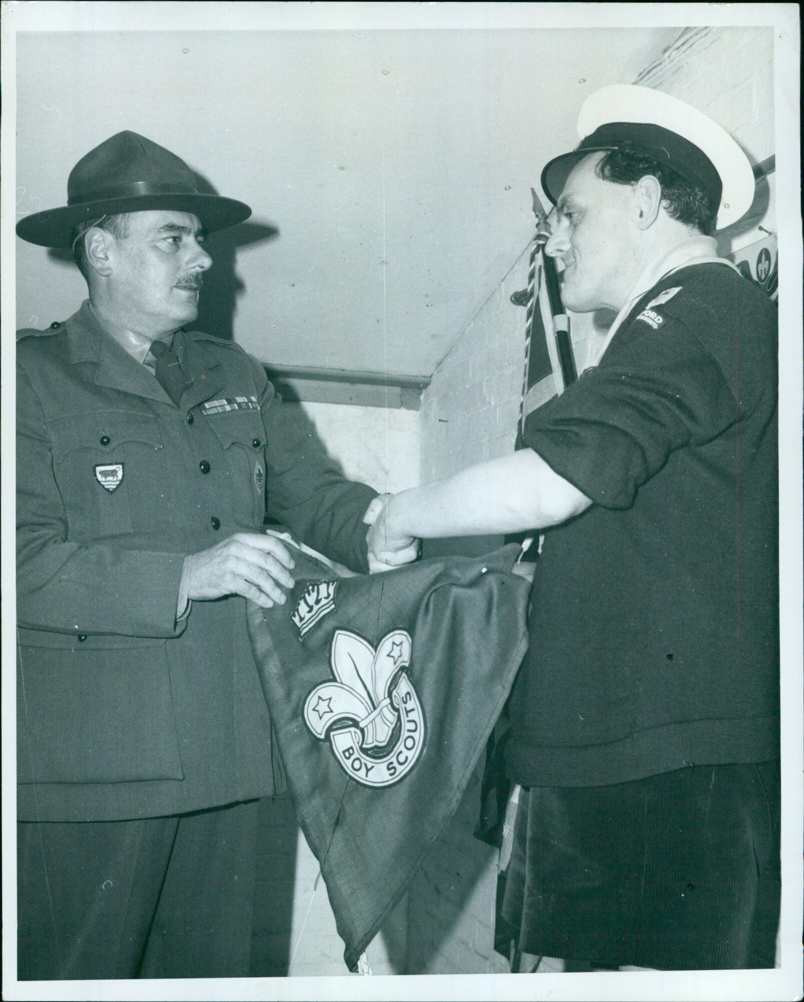 Colmel. H. De Grey WaRter presents the new Admiralty Pennant to Group