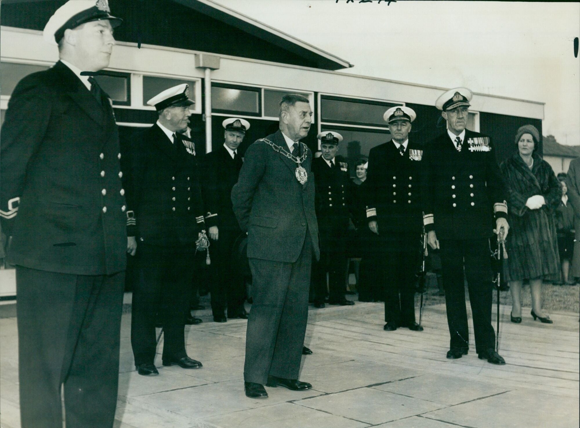 Lord J. N. Hea, Captain of the Royal Navy, presents a certificate of h