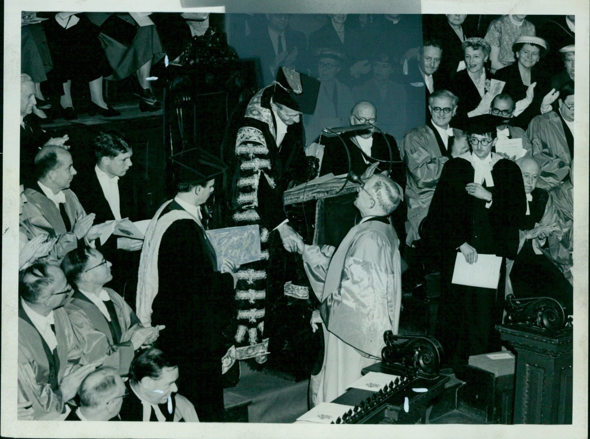 Lord Halifax shakes hands with President Truman during the conferring