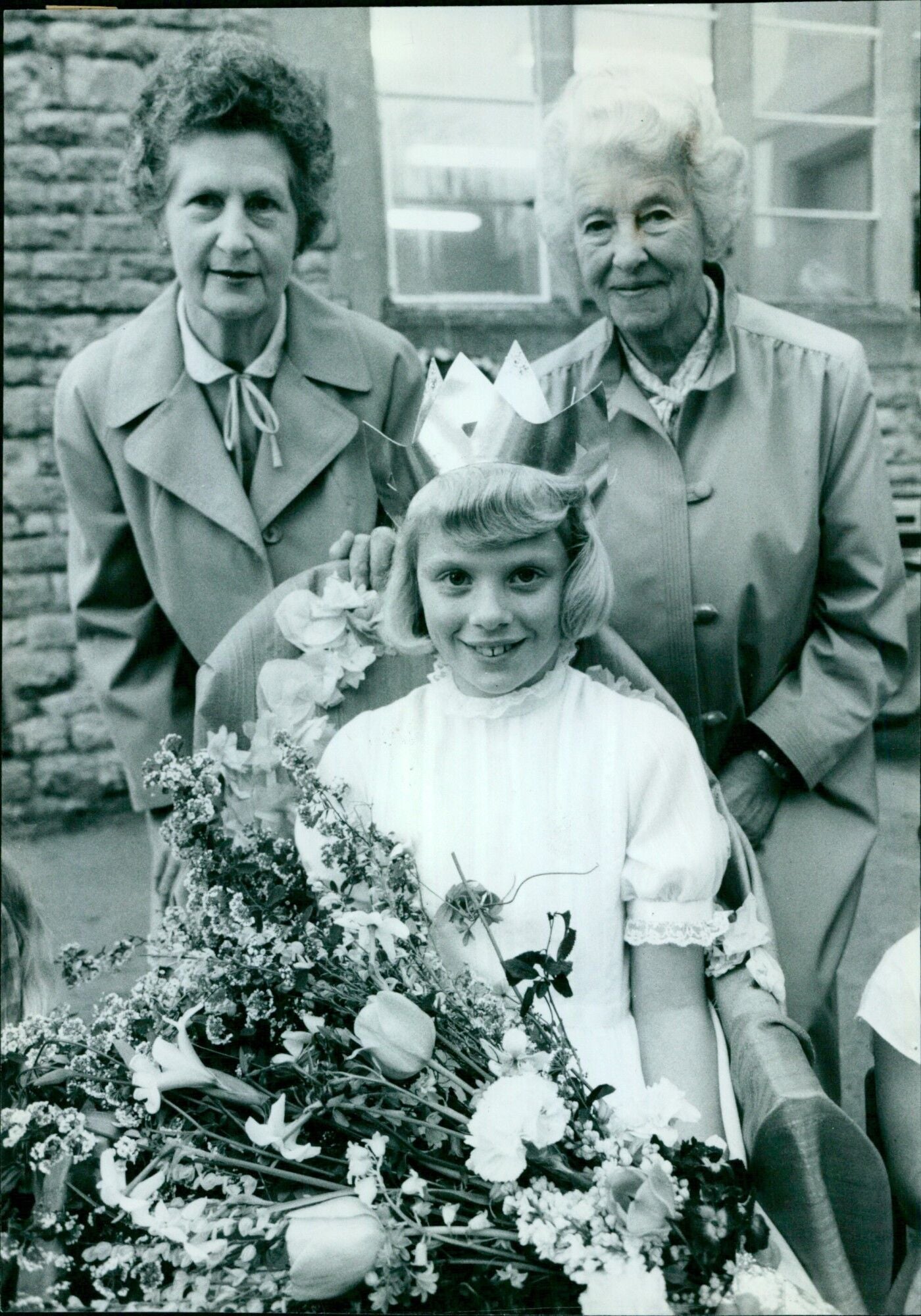 The newly crowned May Queen of Quarry School, Headington, poses with t