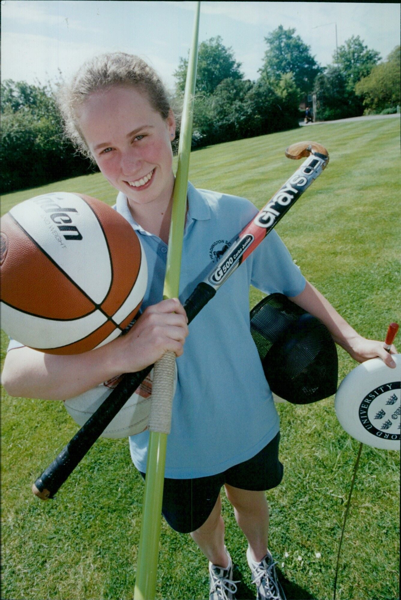 Alice Hands (15) receives a SportsMark Gold Award at Headington Girls