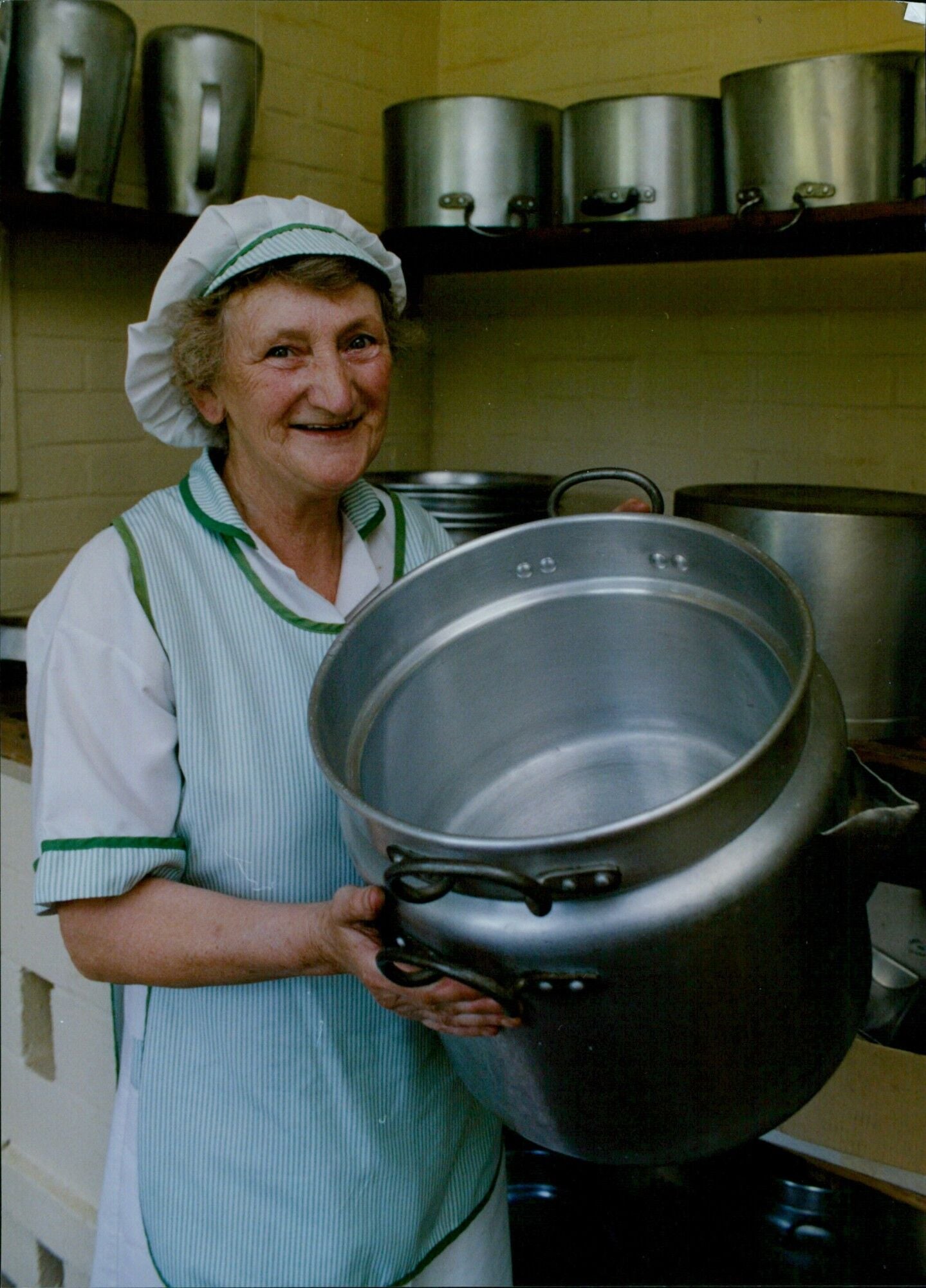 Boiley Sotley, a school cook at 048644 Sotley Primary School, celebrat