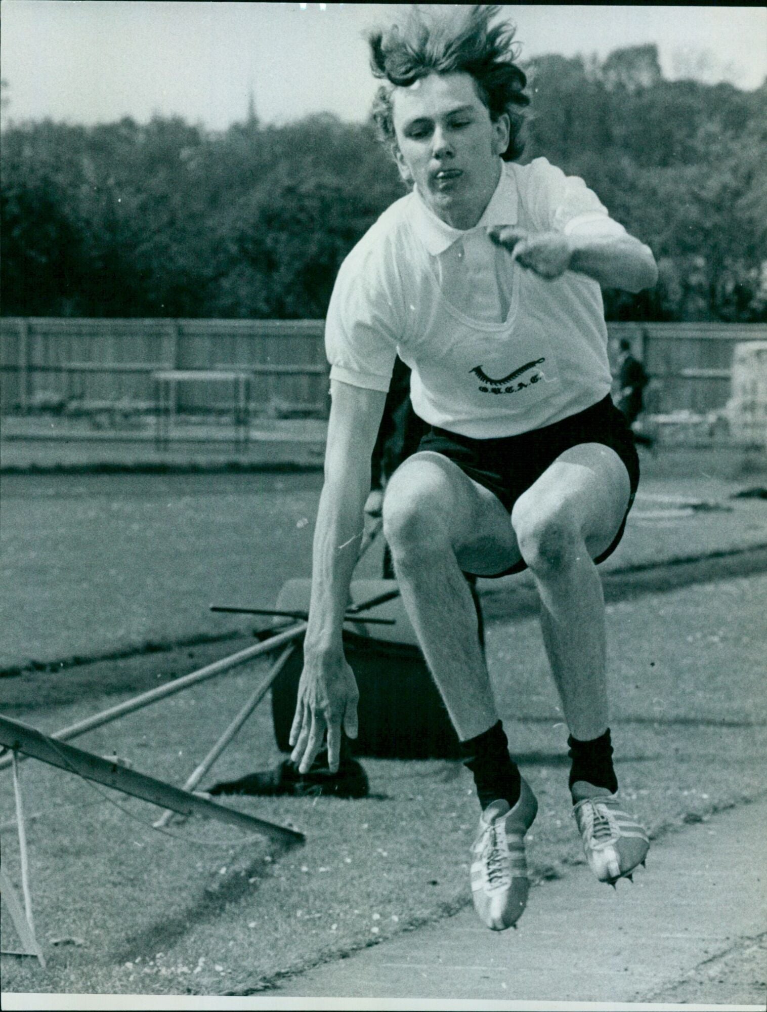 Oxford student competing in the U.A.C. Cup long jump final. - Vintage