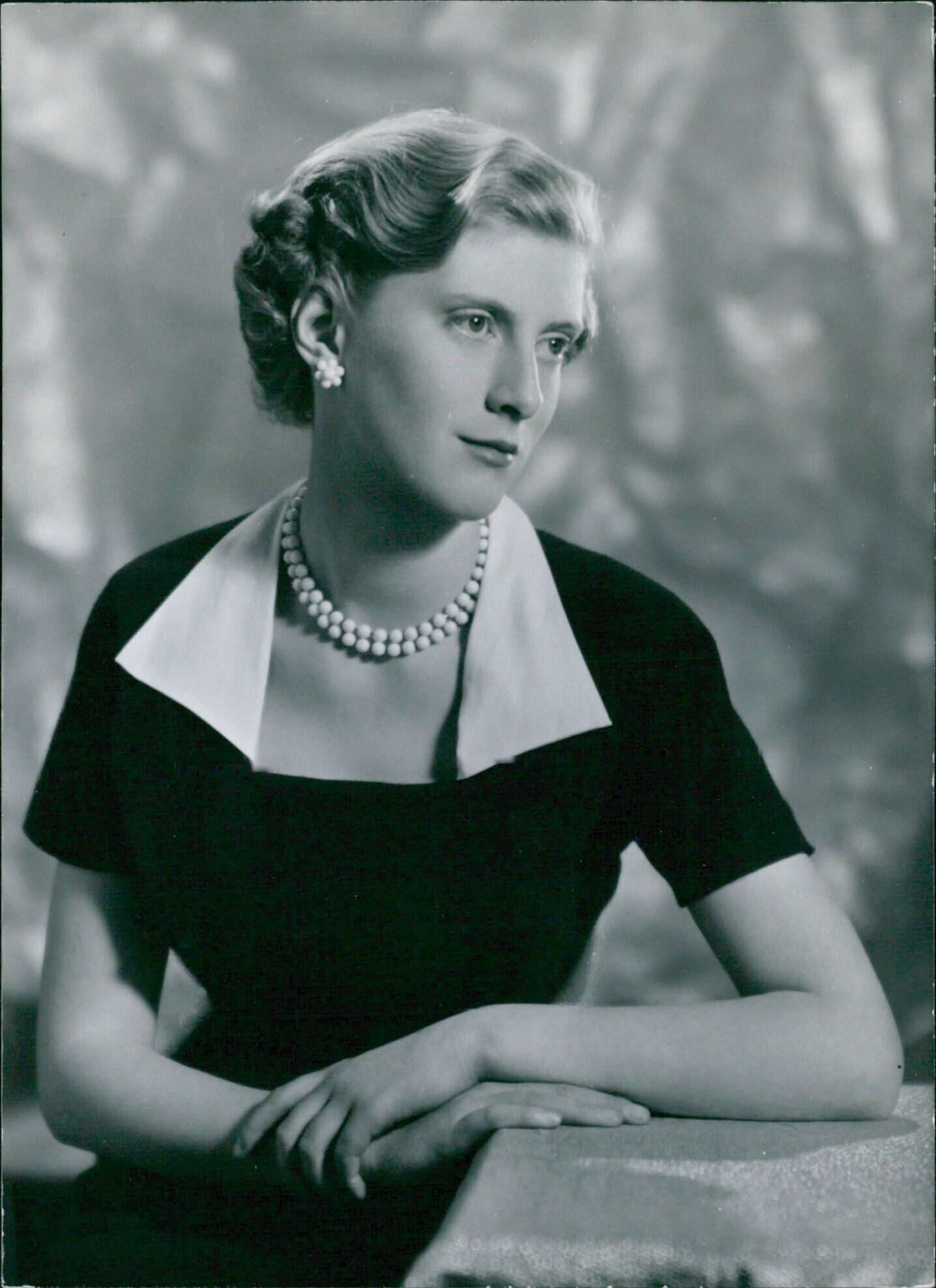Miss Martlyn Reynolds, daughter of Sir John and Lady Reynolds, poses f