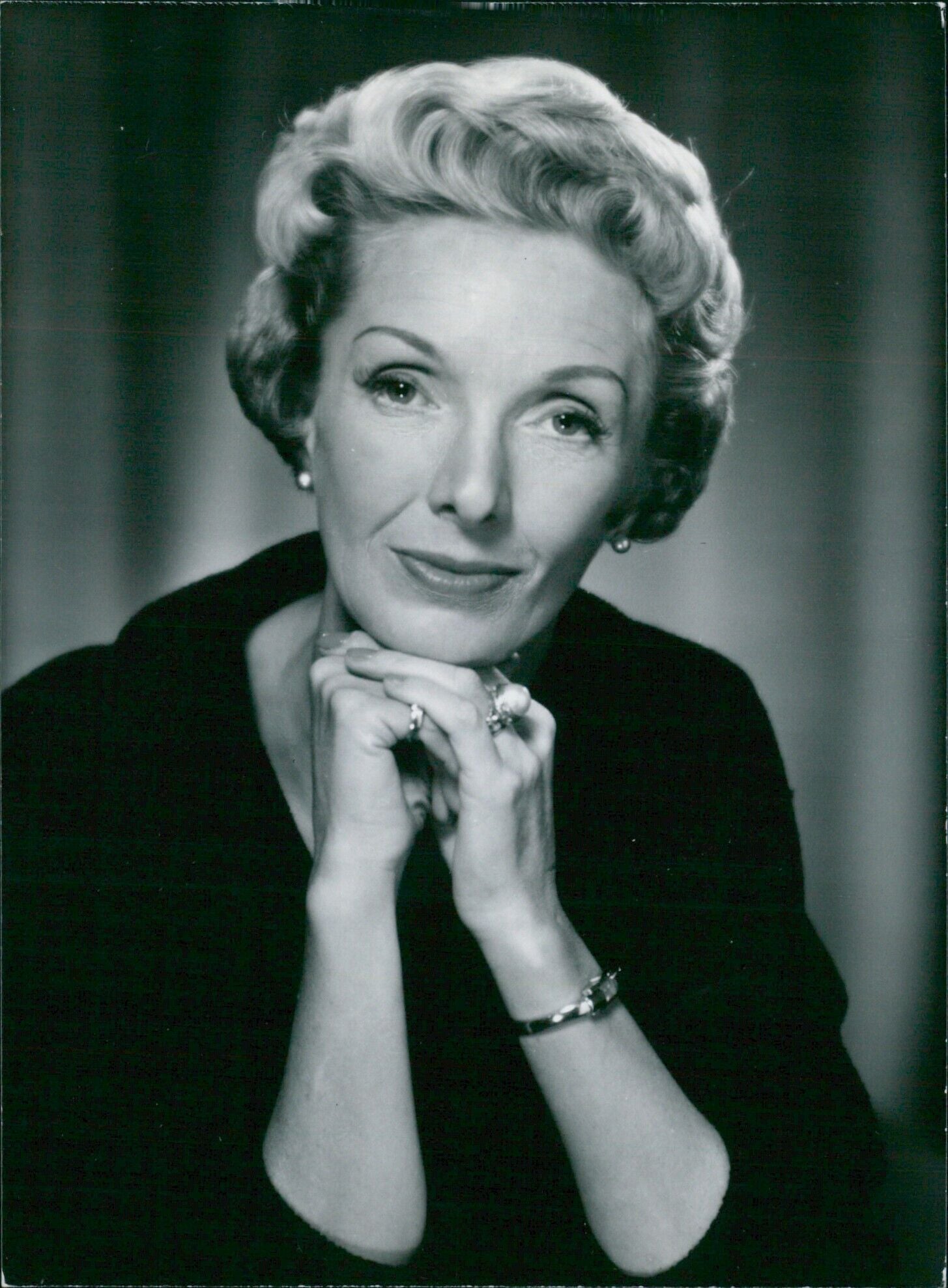 British actress Georgina Cookson strikes a fun pose in front of a came