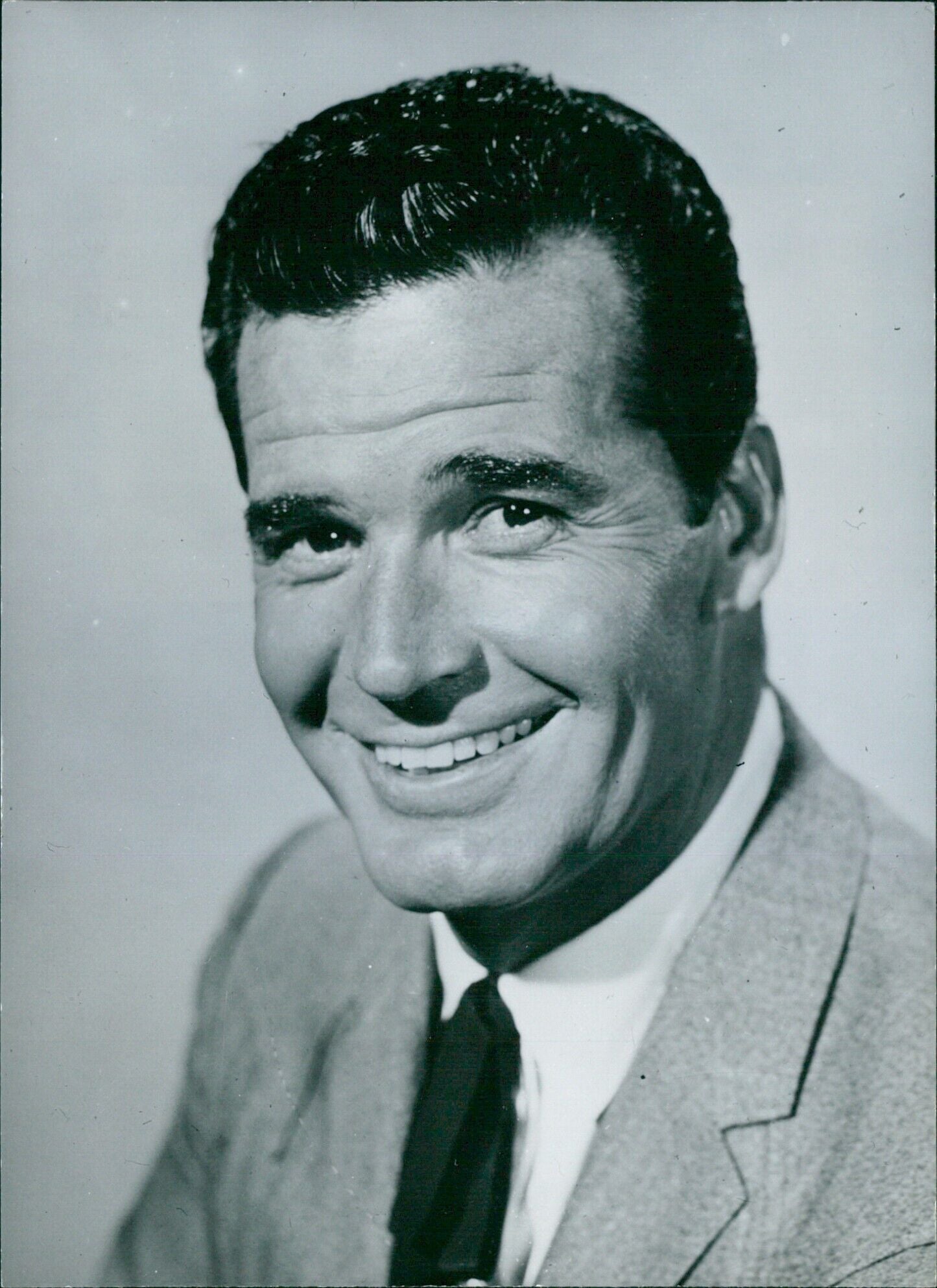Actor James Garner poses for a portrait in 1964. - Vintage Photograph