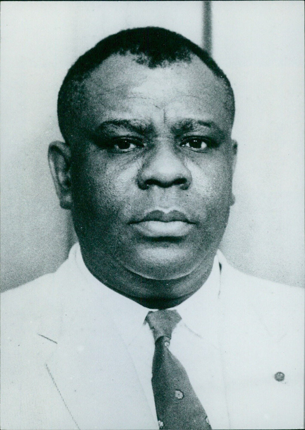 Postmaster-General McKinley Alfred Deshield of Liberia poses for a por