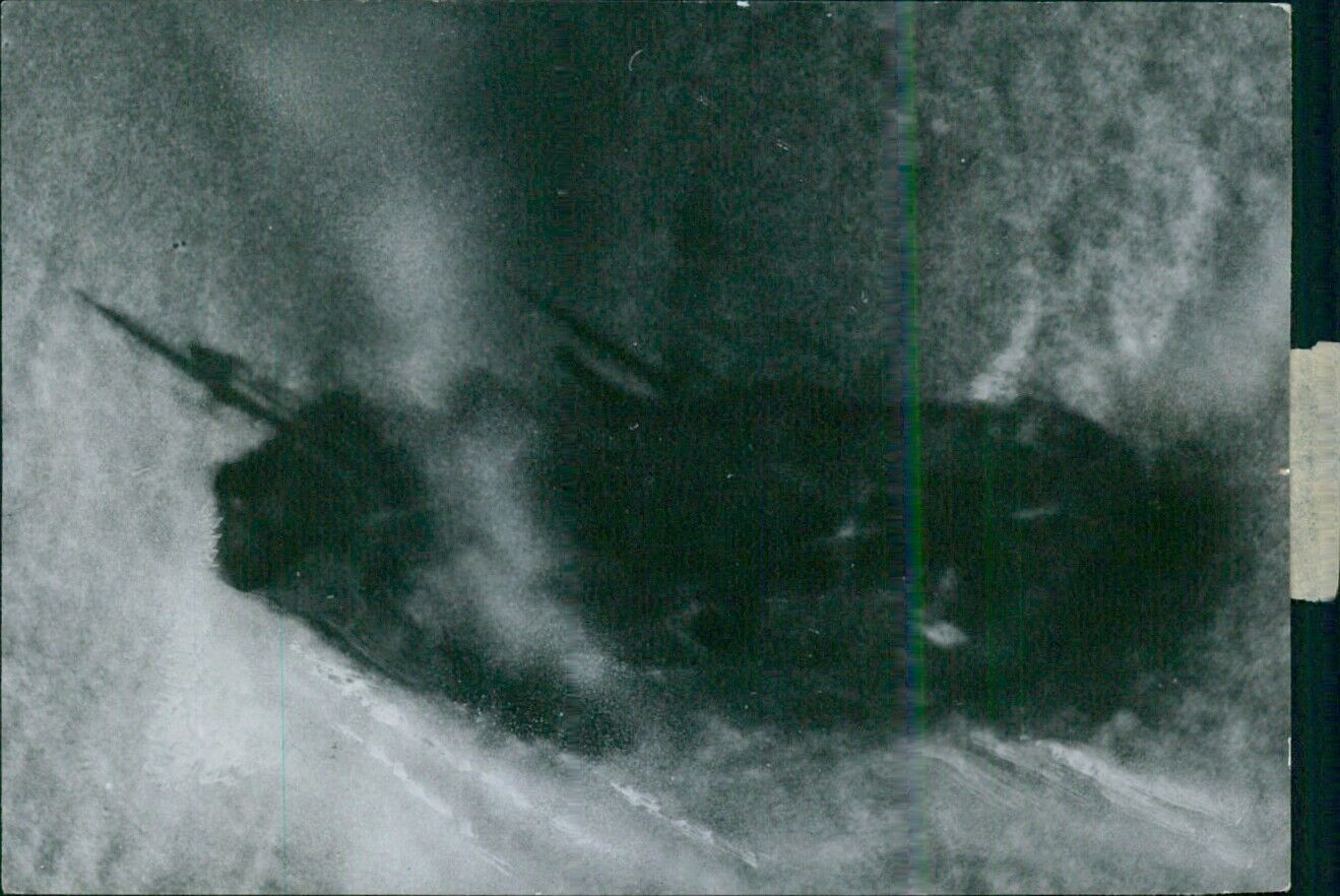 German military aircraft fire on a merchant vessel, as captured by pho