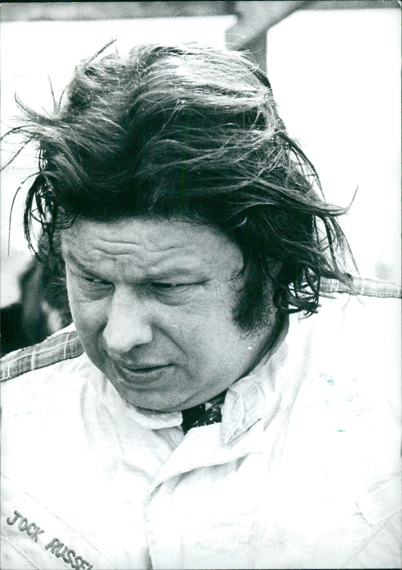 Jock Russe, British racing driver, poses with his McRae car at a Formu