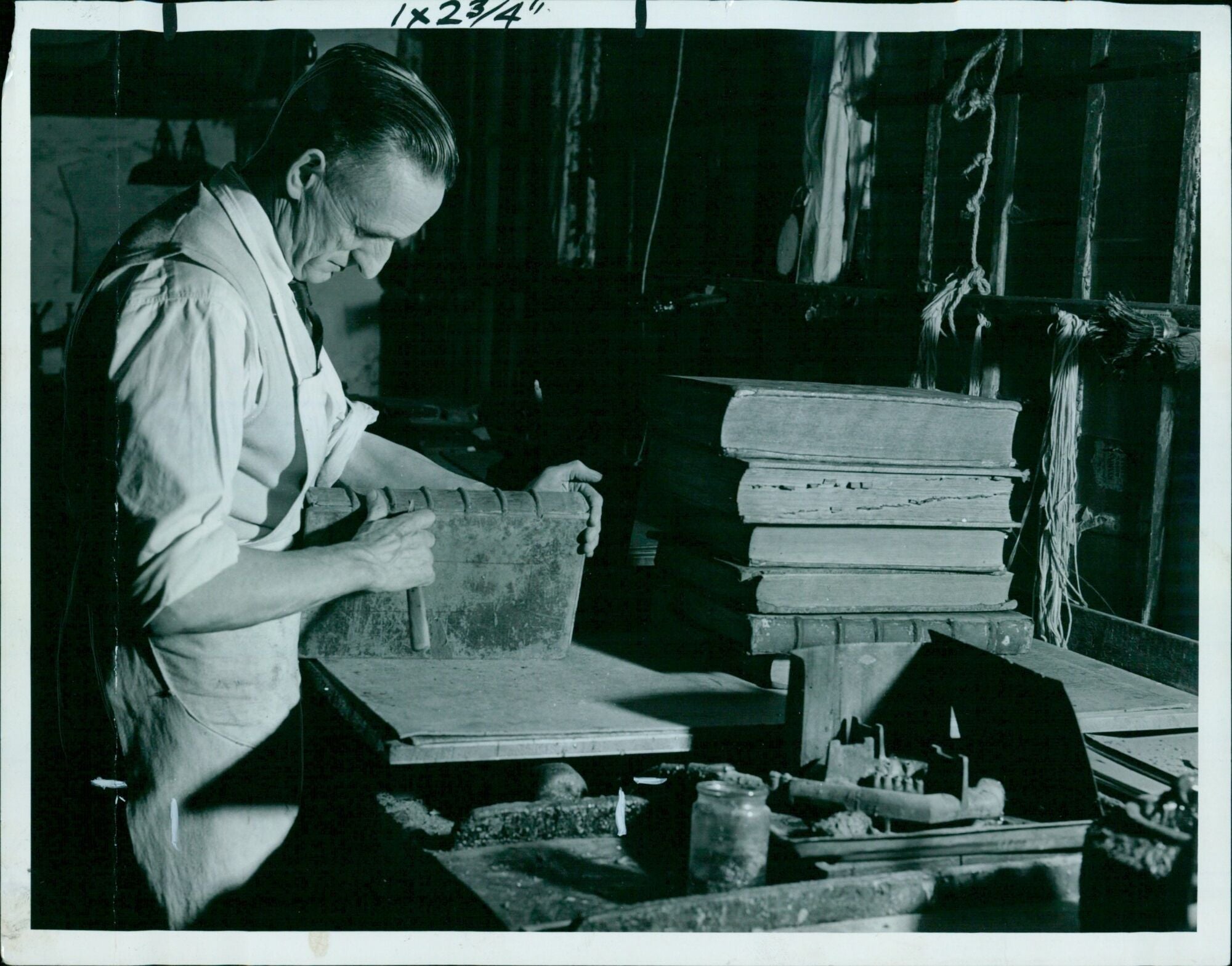 An old book being repaired at MALTBY'S Book Binders. - Vintage Photogr