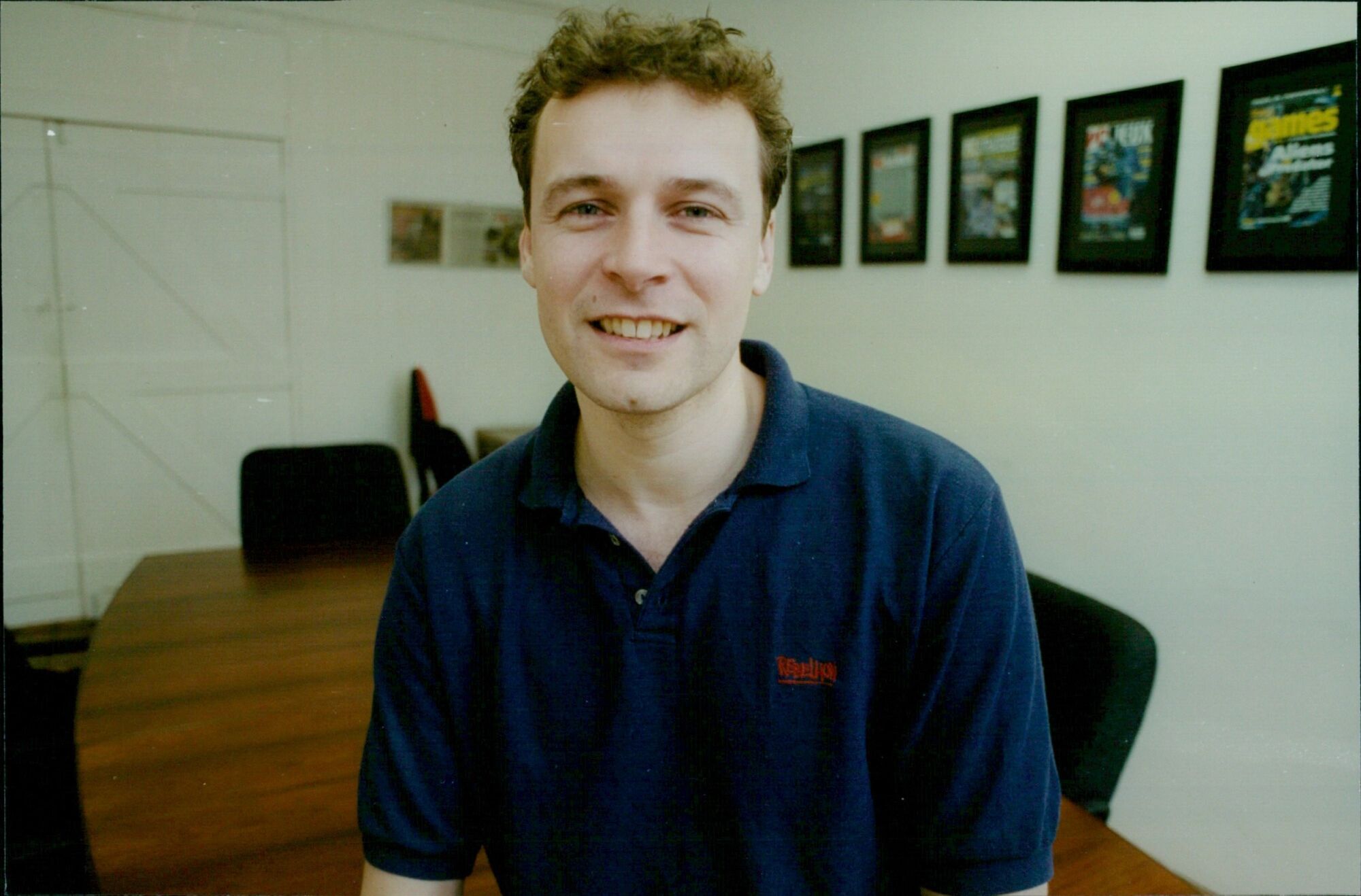 Jason Kingsley, CEO of Rebellion, holds the cover of their successful