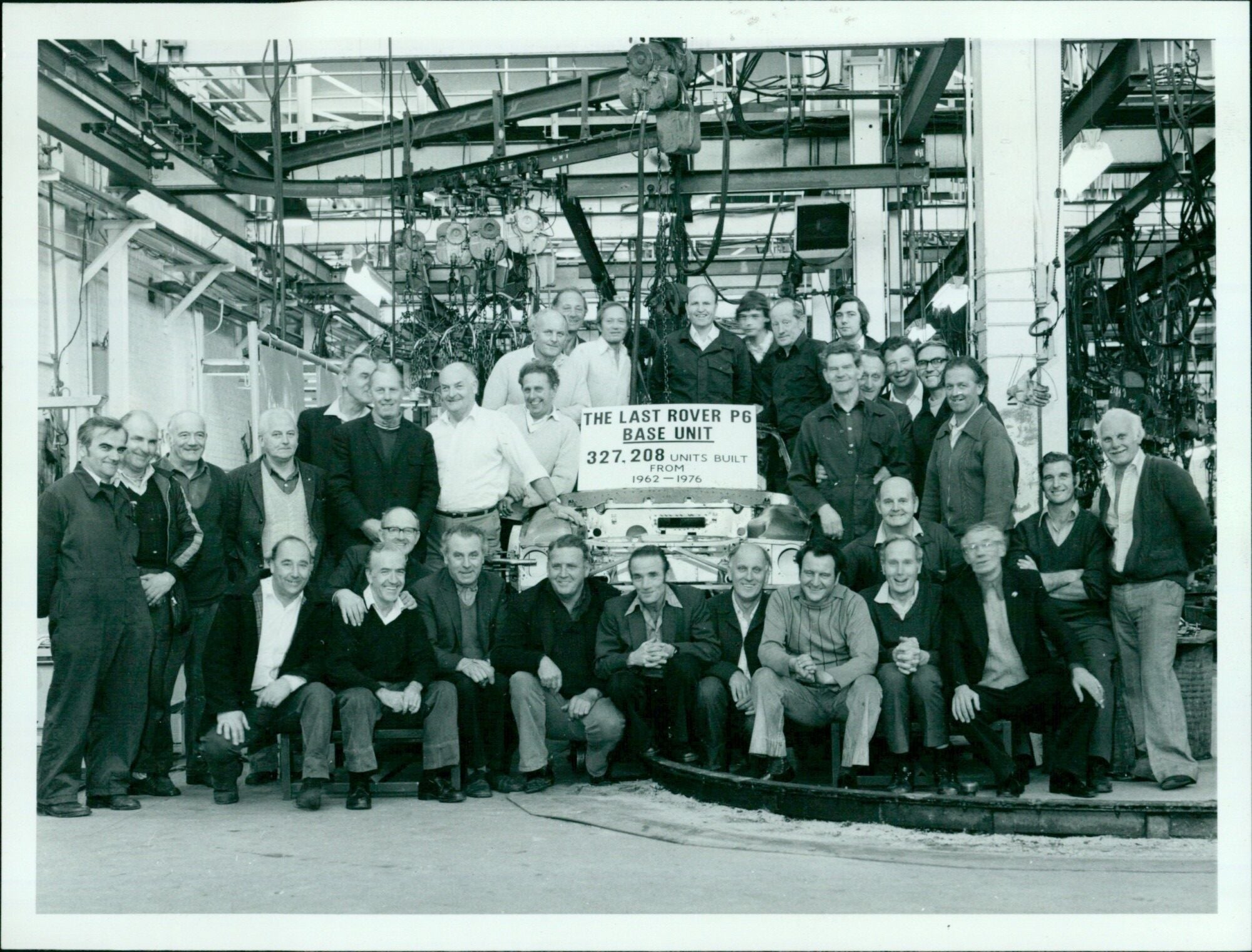 An iconic British car, the Rover P6 Base Unit 327, parked in a garage.
