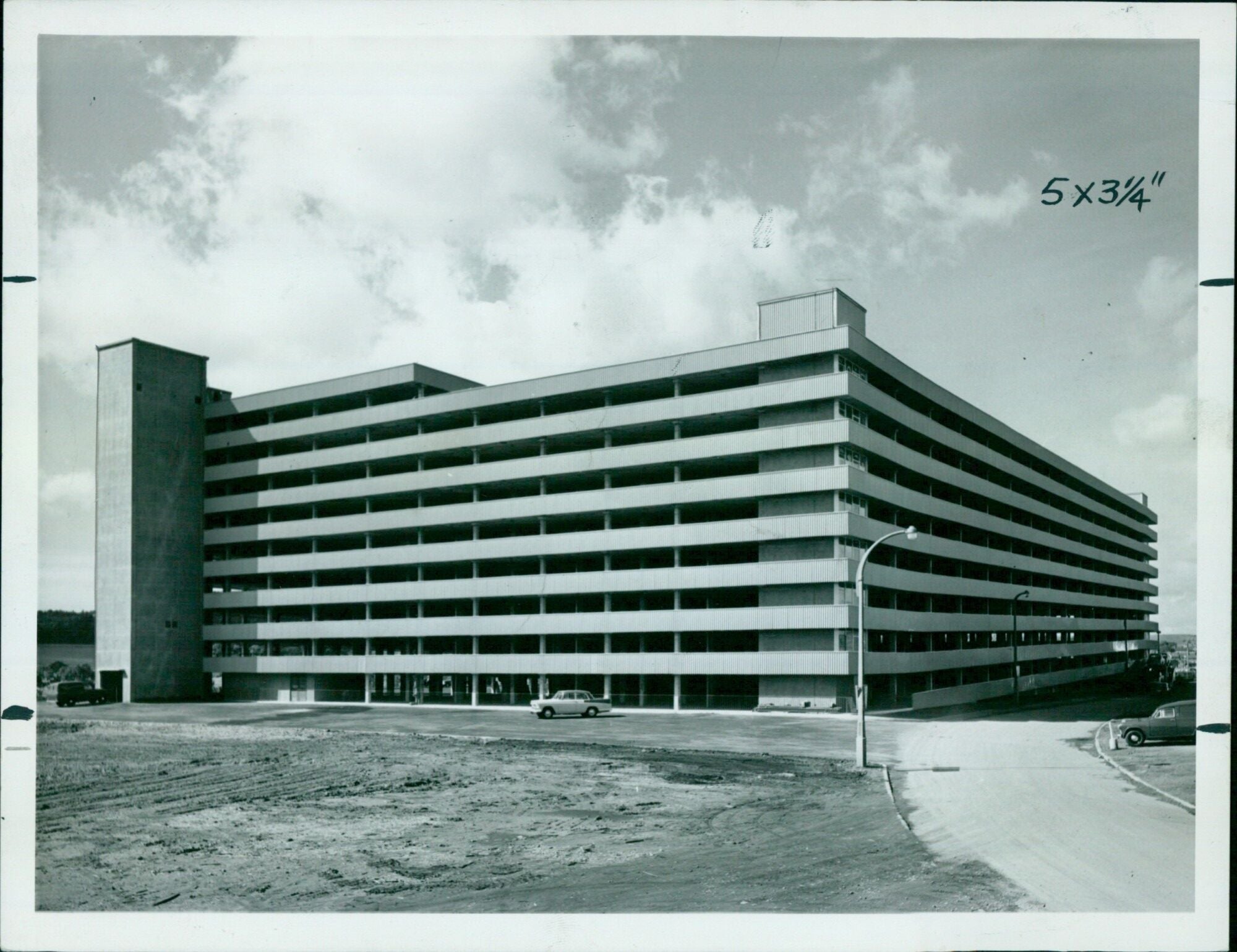 Prime Minister Macmillan and President Kennedy wave to the crowd durin