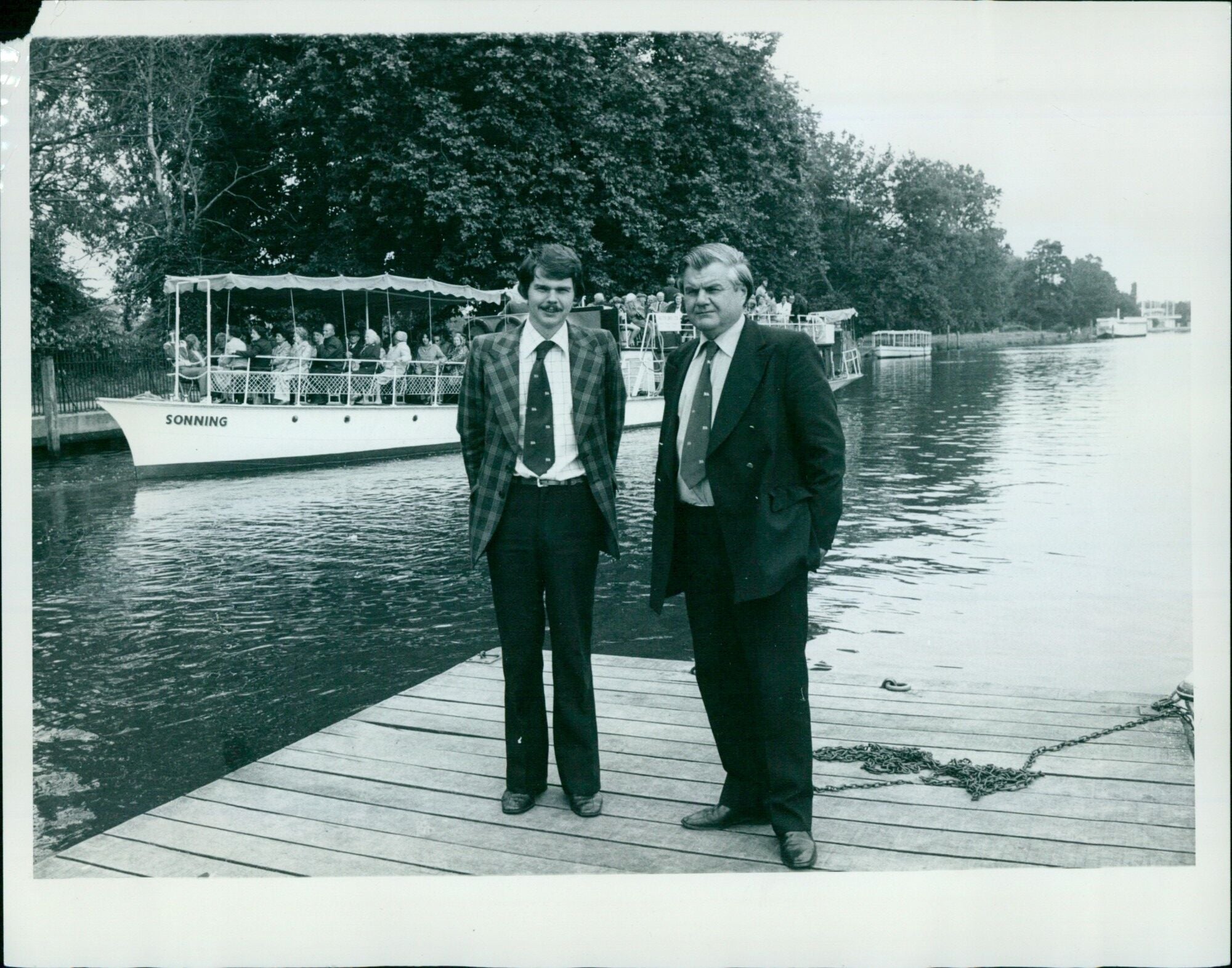 Mr John Salter and Mr Arthur Salter standing in front of the Thames.