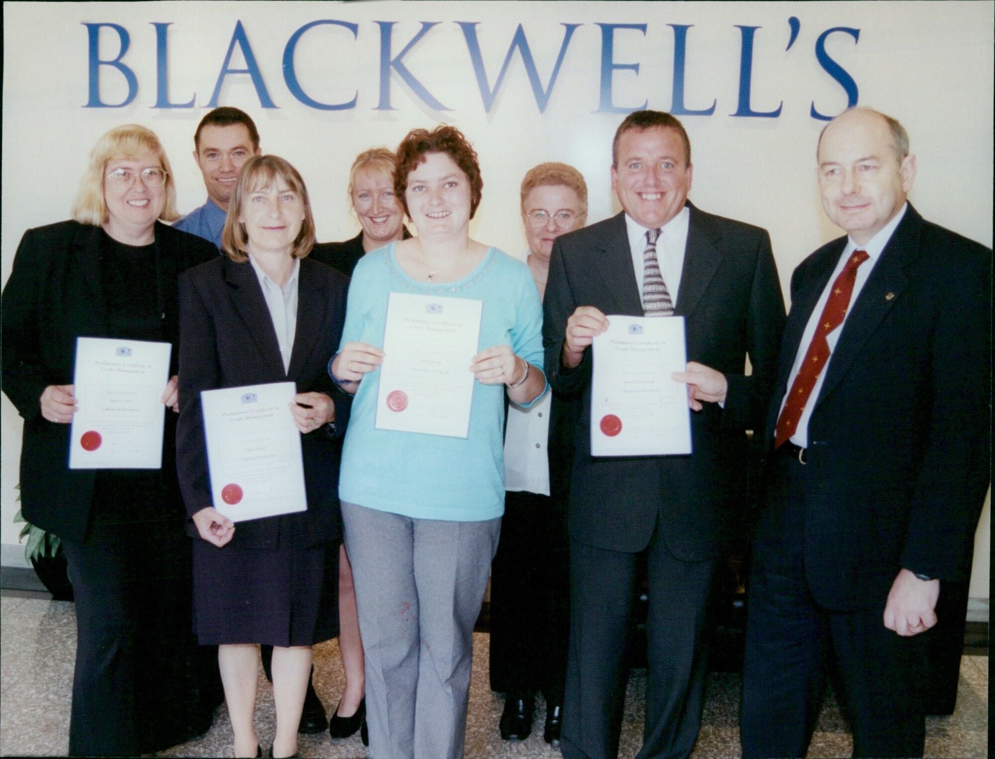 Blackwell's staff receive certificates from Colin Hingston. - Vintage