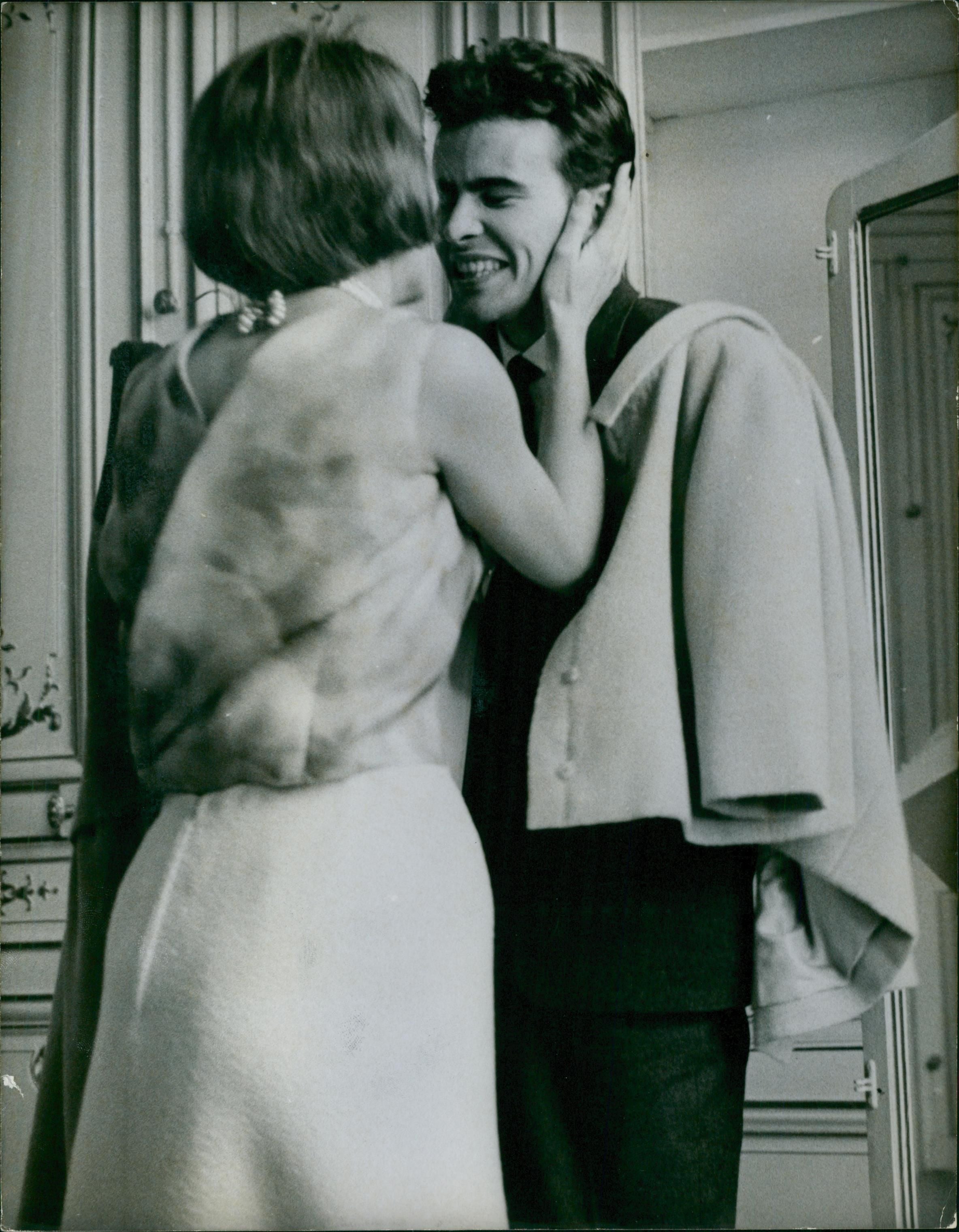 Woman romancing with Horst Buchholz and smiling, 1968. - Vintage Photo