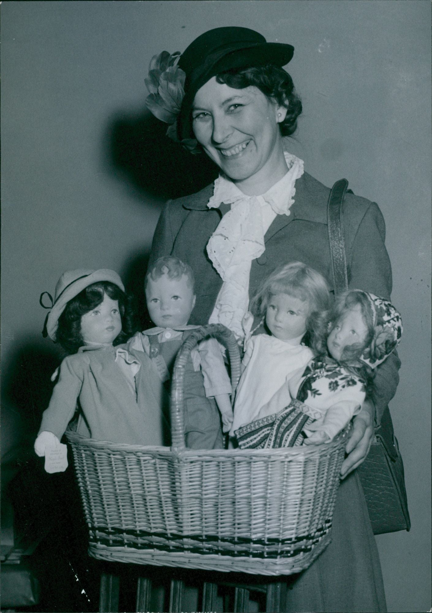 The Toy Fair in Liljevalch Art Hall. Miss Magda Boalt with a basket do