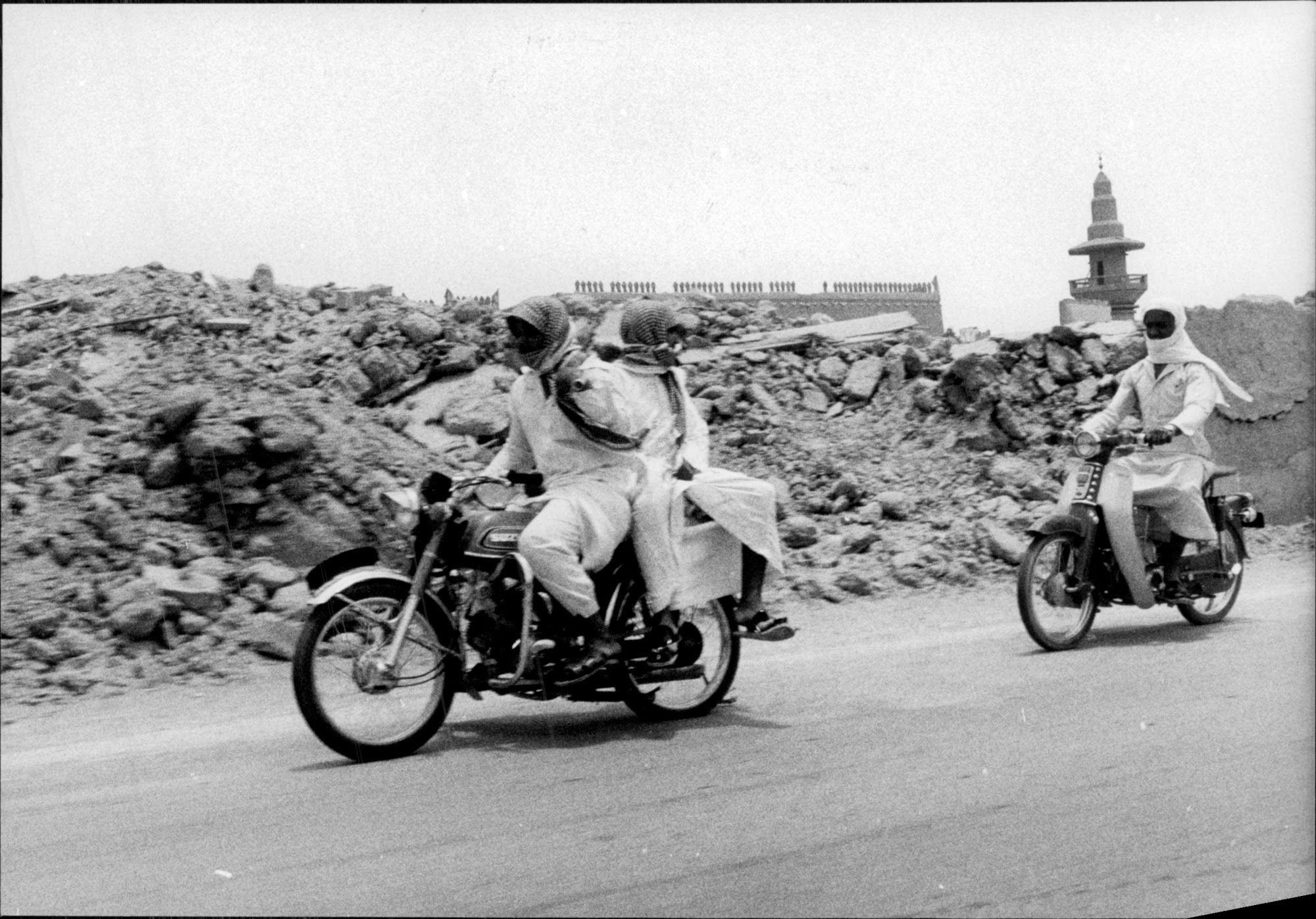 Saudi Arabian men ride a motorcycle - Vintage Photograph