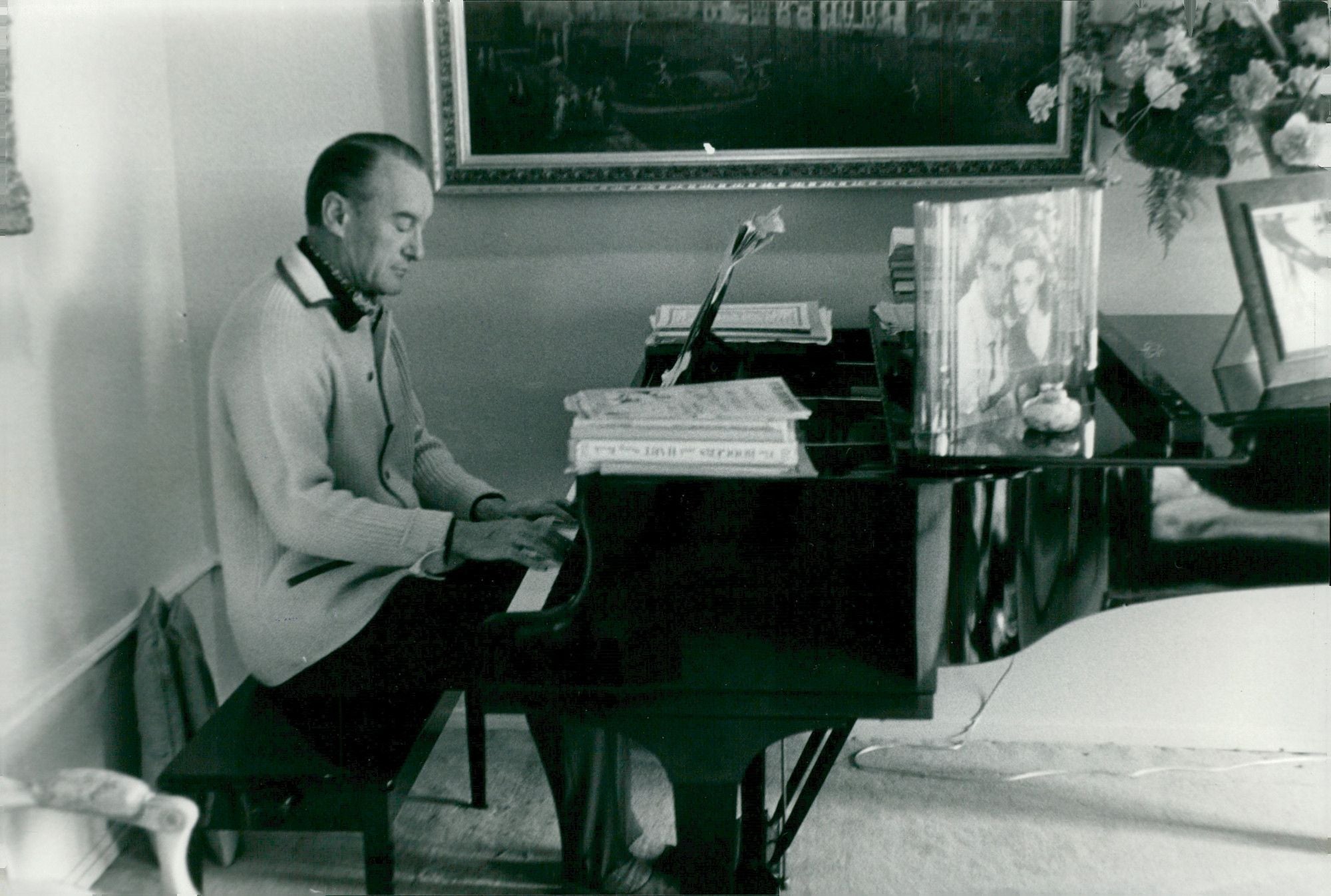 George Sanders at the piano in a 1960 photo - Vintage Photograph